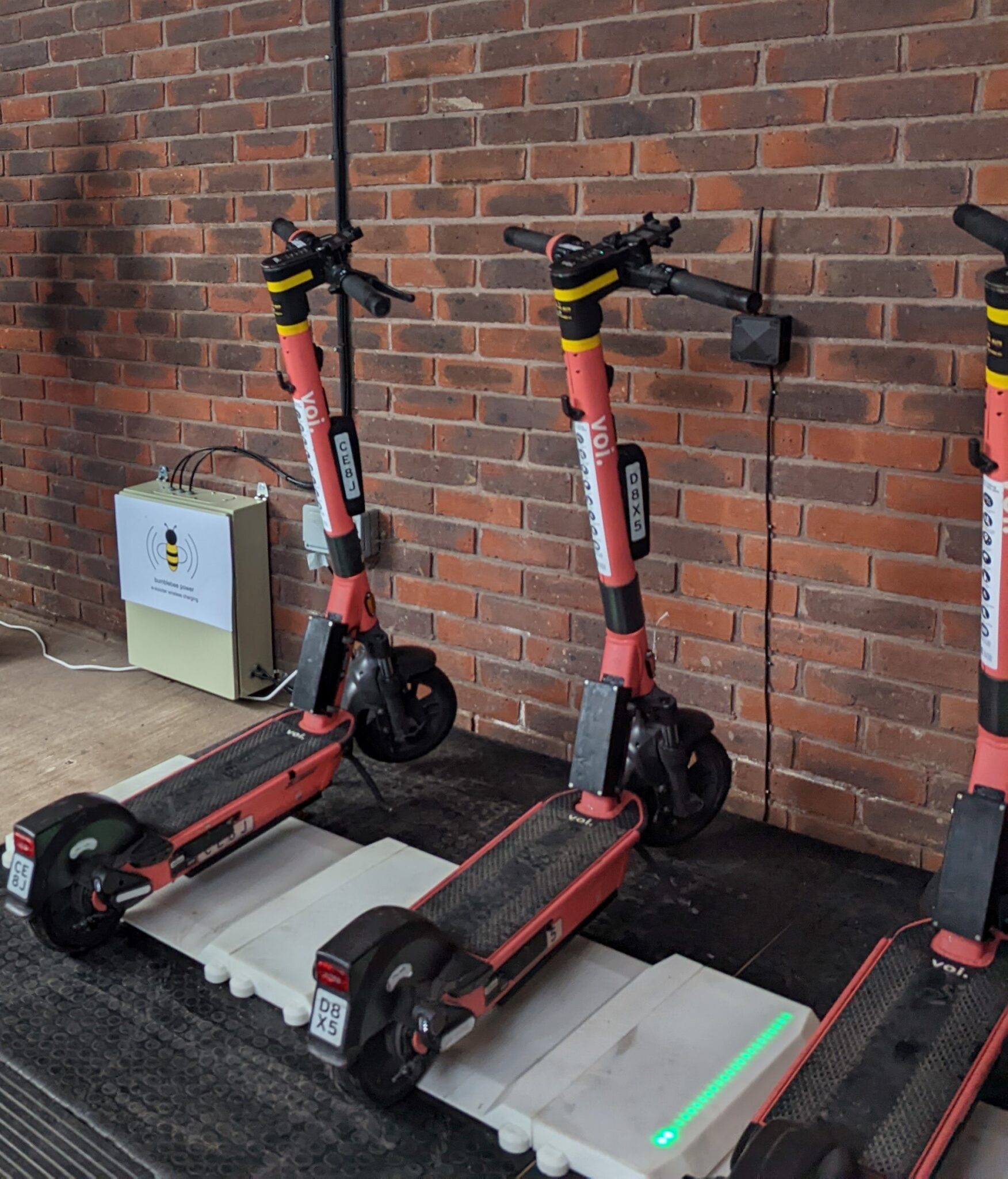 Voi and Bumblebee Launch UK’s First Wireless E-Scooter Charging Trial ...